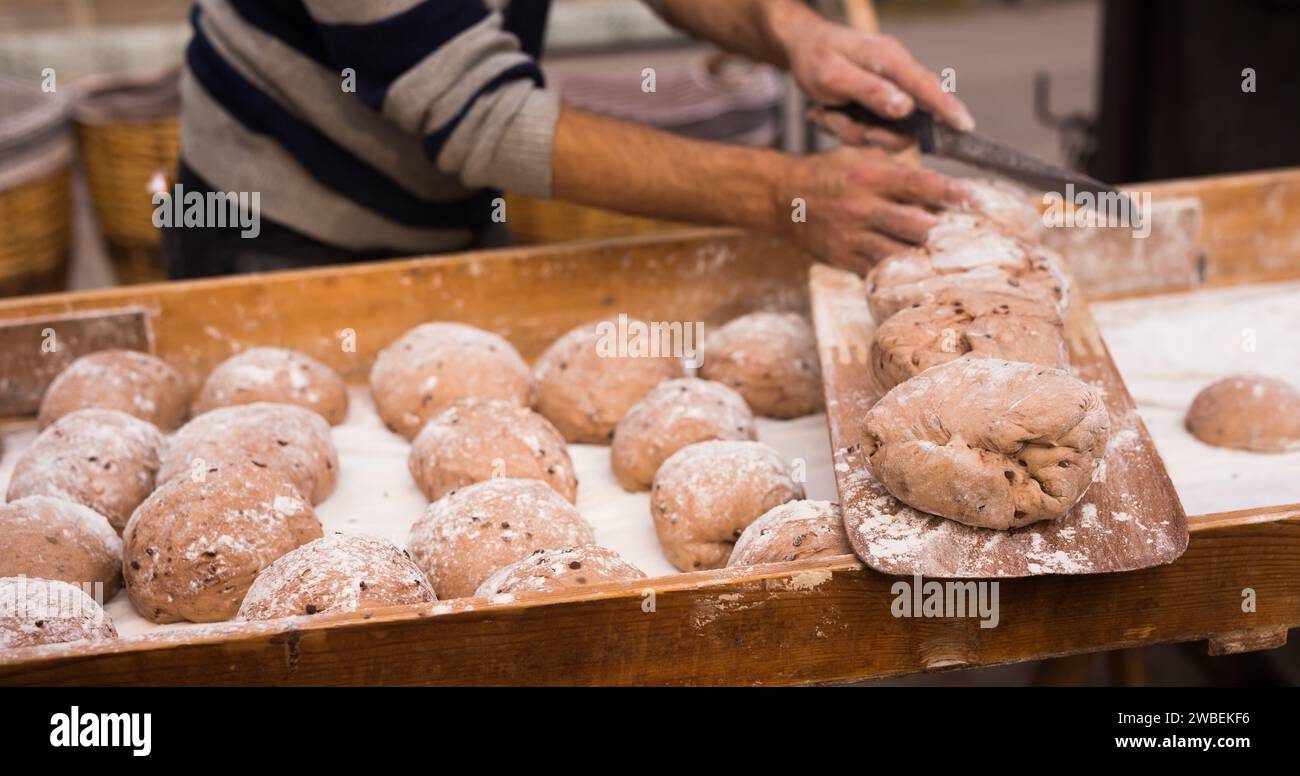 Bread preparation. loaves of dough before baking Stock Photo - Alamy