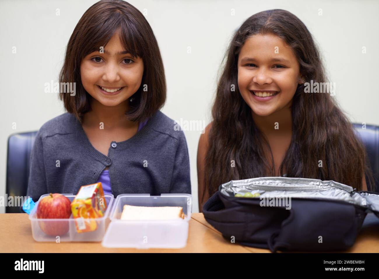 Girl, friends and portrait with lunch at school for recess, break or ...