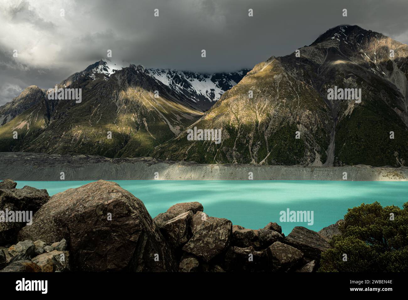 Tasman glacier and valley with snow capped mountains, glacial blue lake ...