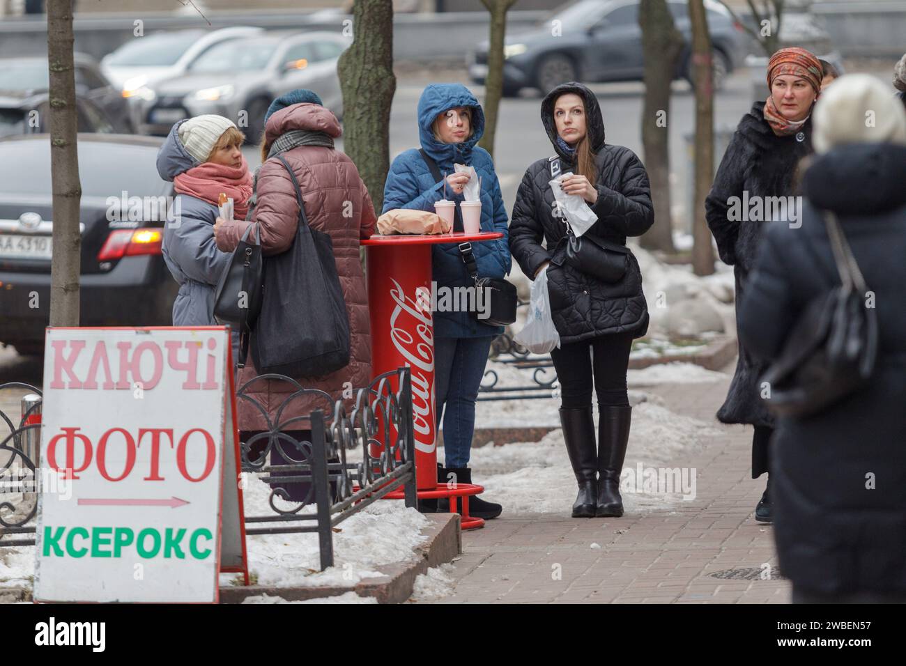 KYIV, UKRAINE - JANUARY 10, 2024 - People eat outside of Kyivska ...