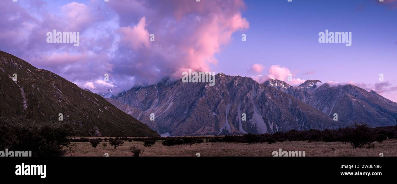 Panorama of snow capped mountains at sun set hi-res stock photography ...