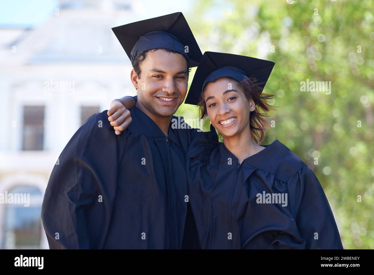 Graduation, portrait and couple of friends smile to celebrate success ...