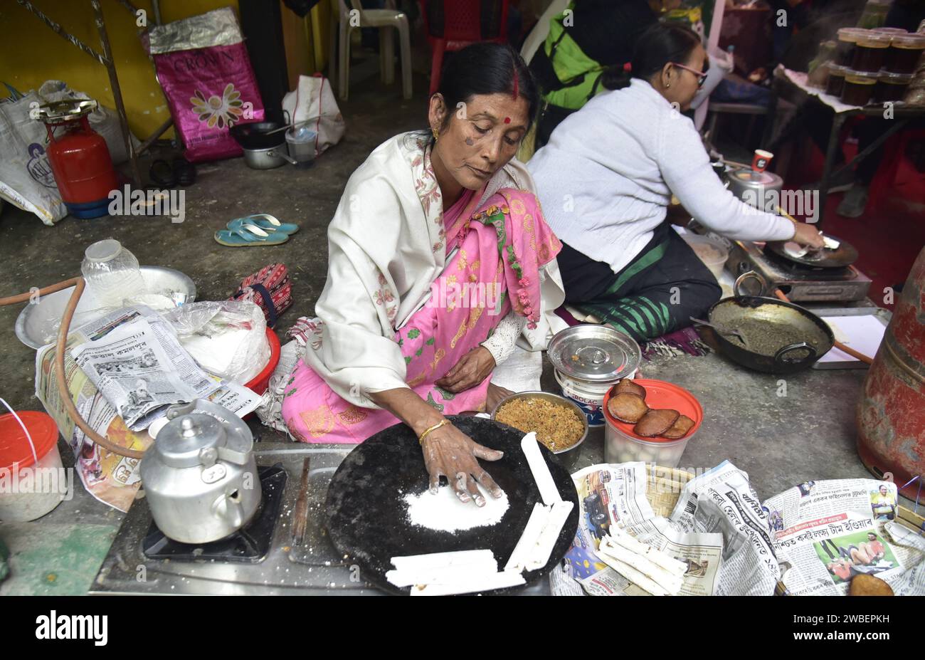 Guwahati, Guwahati, India. 10th Jan, 2024. Assamese women making pitha ...