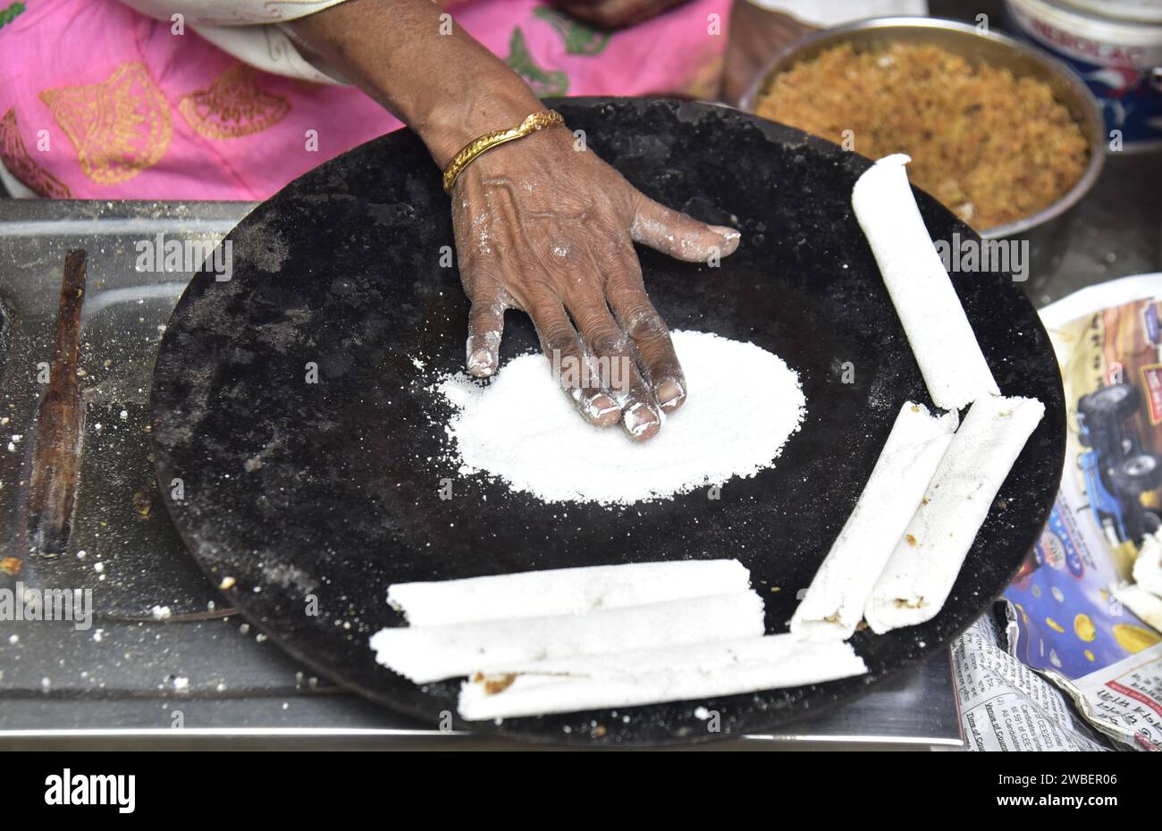 Guwahati, Guwahati, India. 10th Jan, 2024. Assamese women making pitha ...