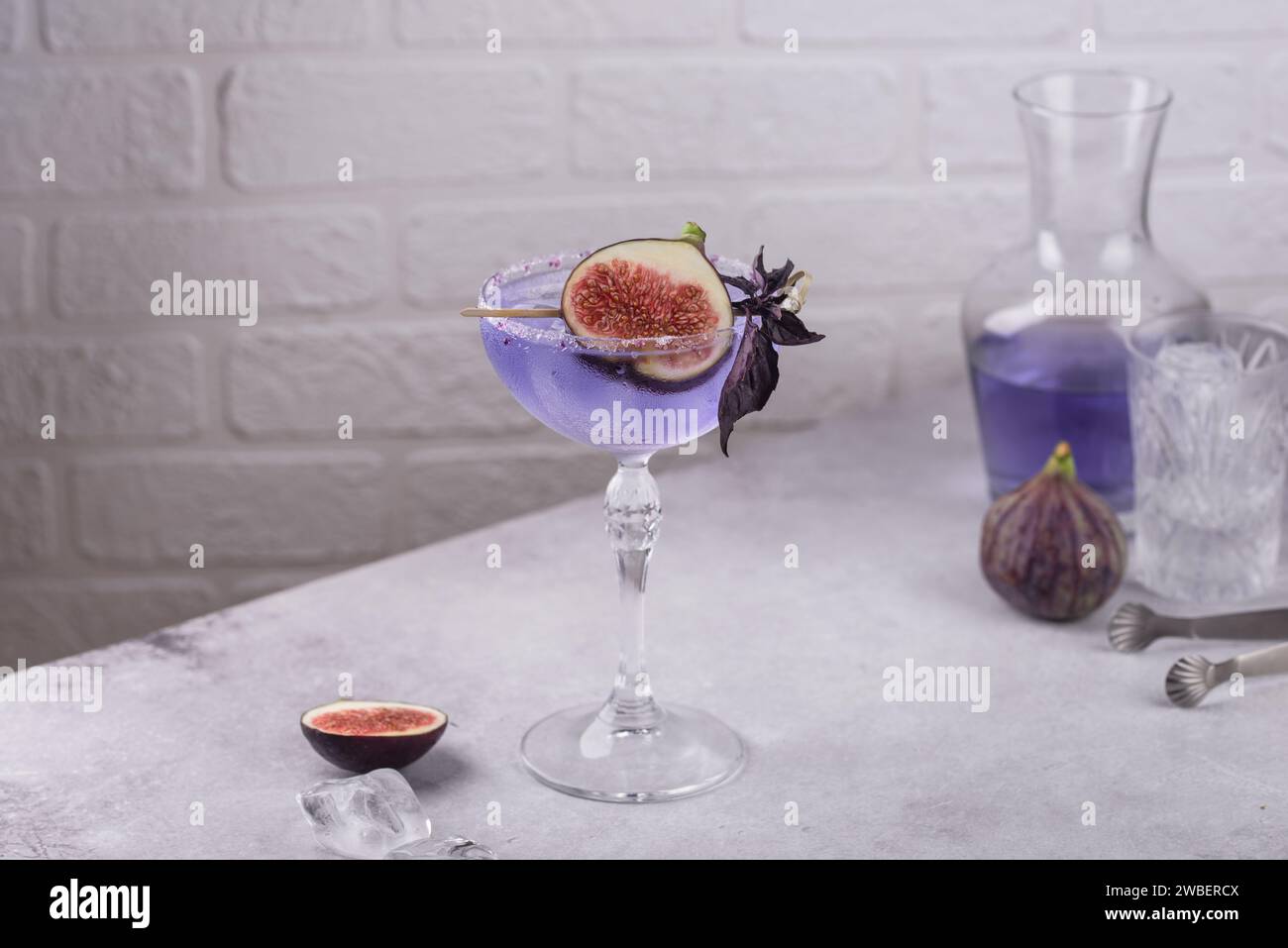 Purple fig cocktail or mocktail in glass Stock Photo - Alamy