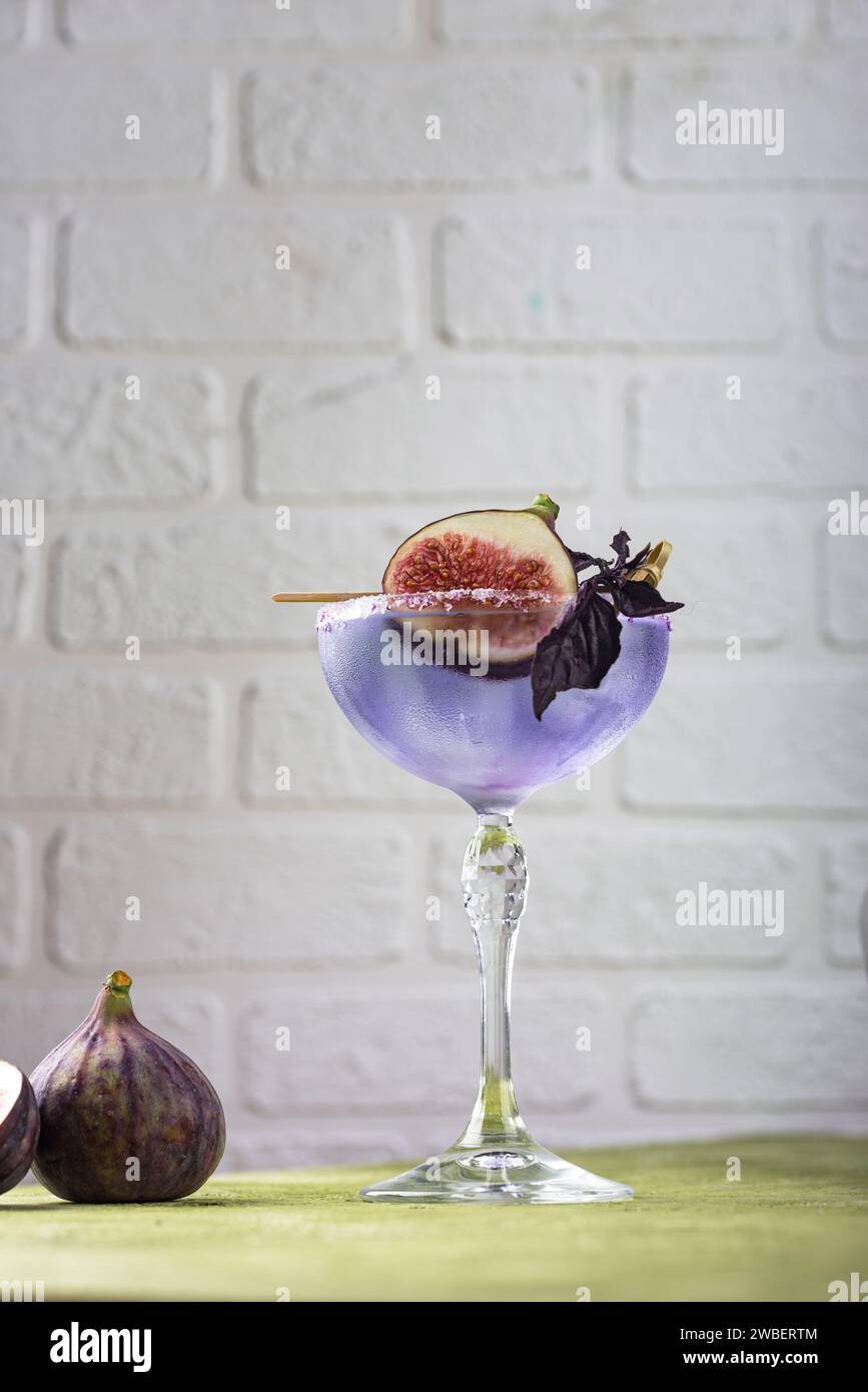 Purple fig cocktail or mocktail in glass Stock Photo - Alamy