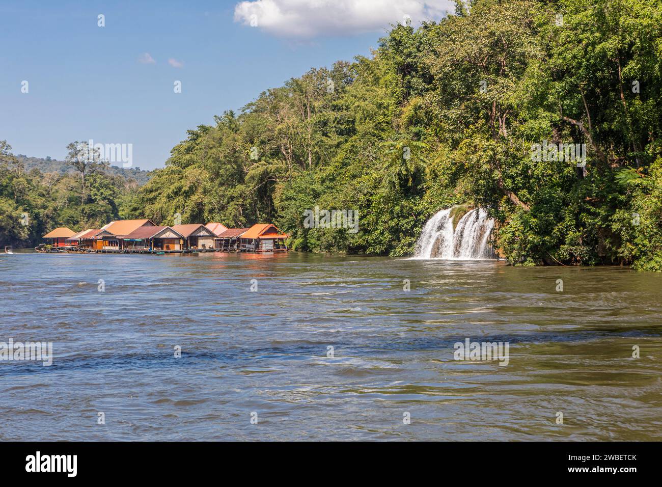 Sai Yok Waterfall and floating village on the River Kwai Stock Photo ...