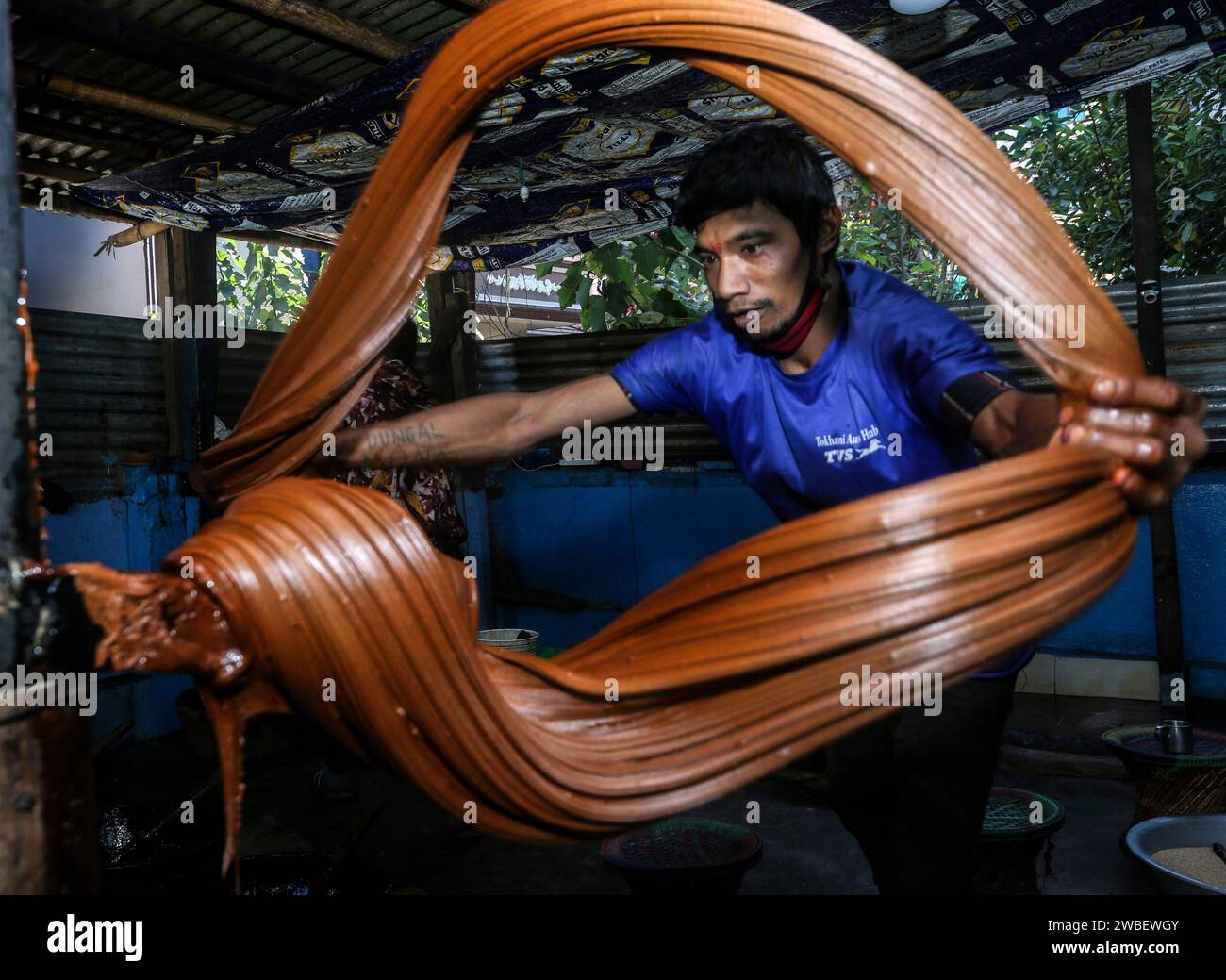 January 10, 2024, Kathmandu, Bagmati, Nepal: A man whips the hard ...