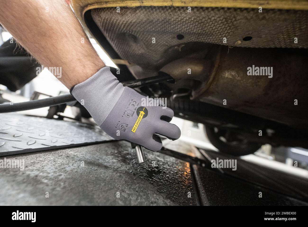 Stuttgart, Germany. 10th Jan, 2024. An employee of the testing ...