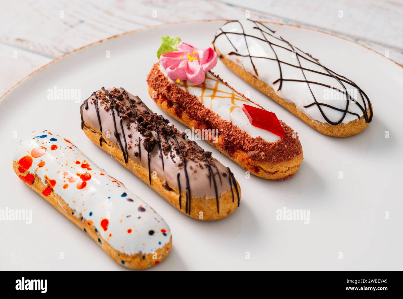 Beautiful delicious french eclairs set with original cream decor on ...