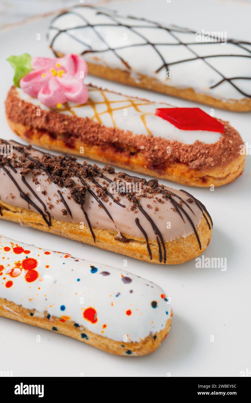 Beautiful delicious french eclairs set with original cream decor on ...