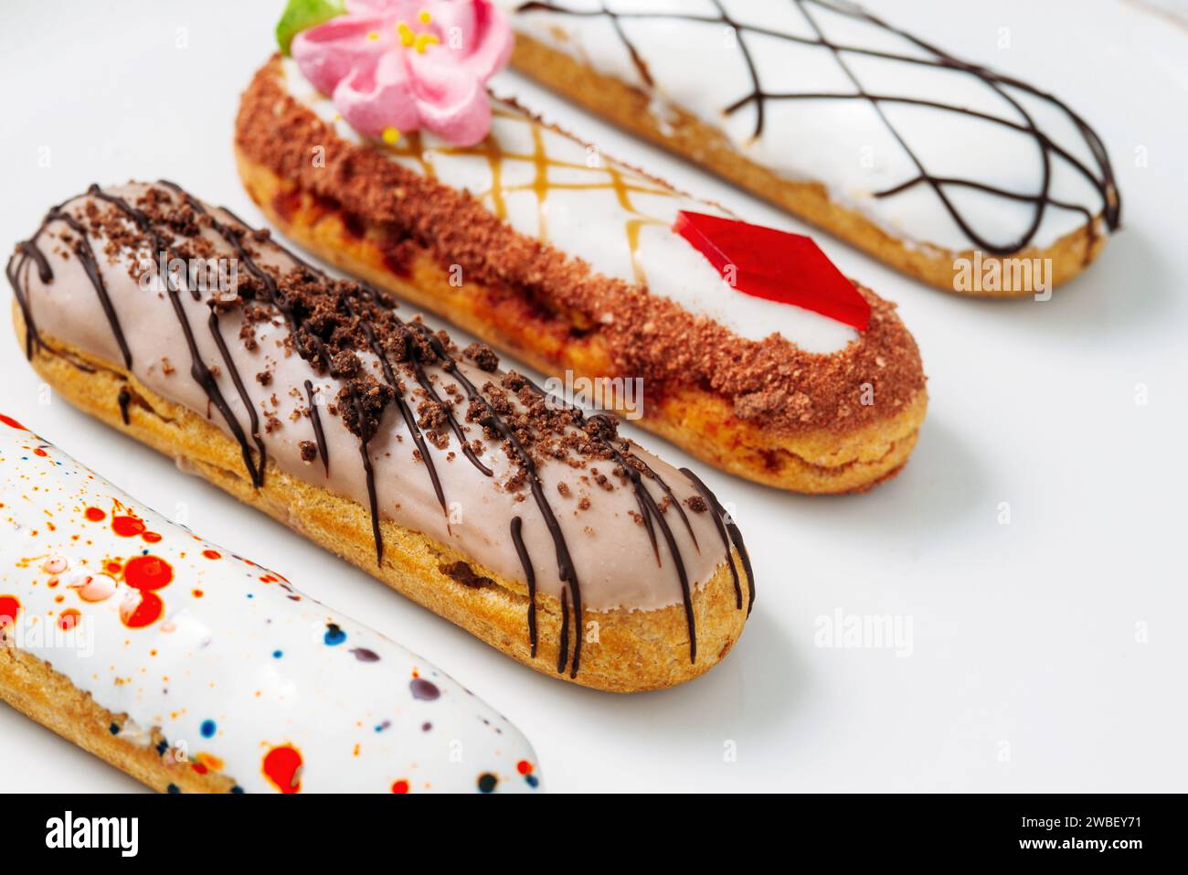 Beautiful delicious french eclairs set with original cream decor on ...