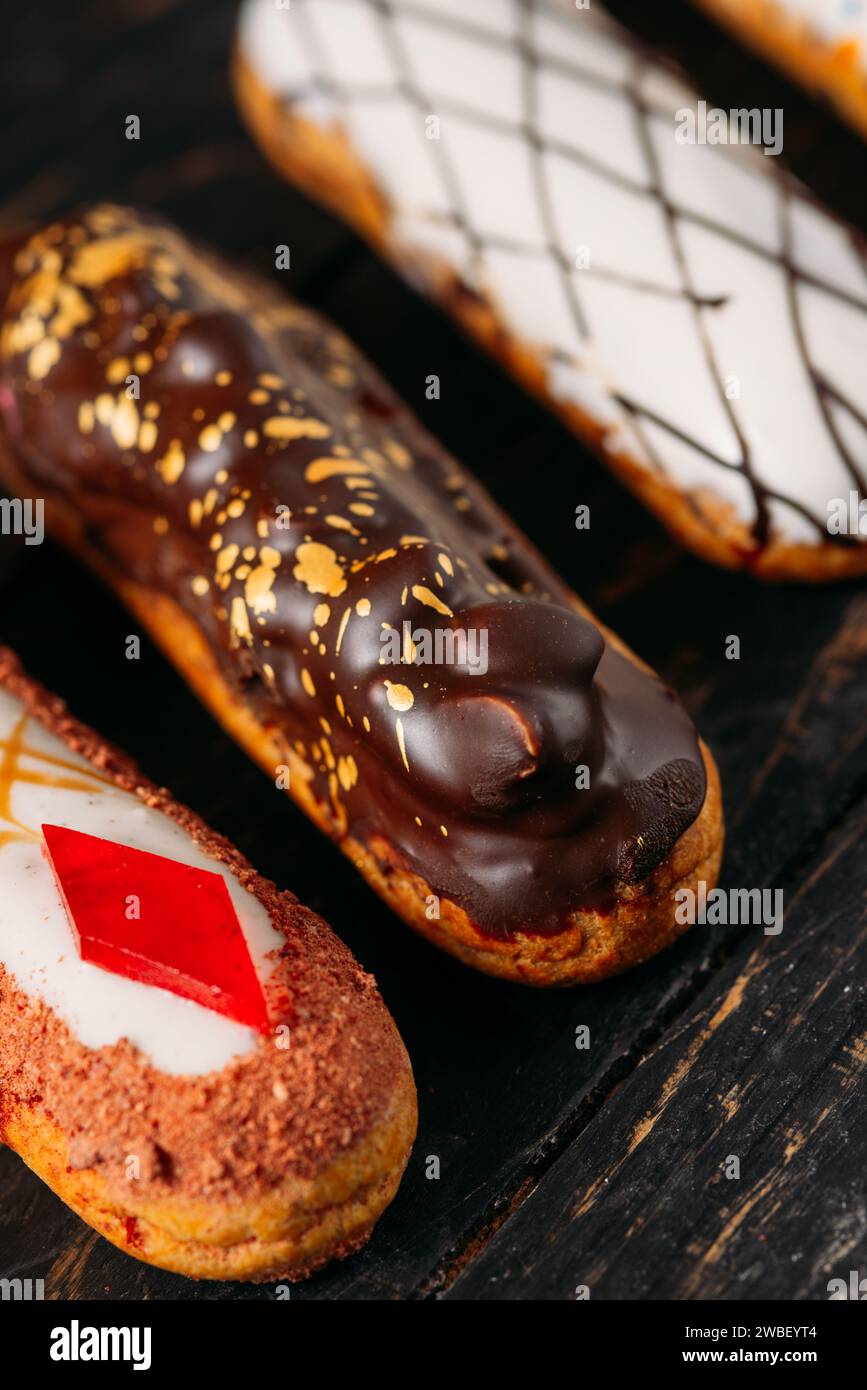 Beautiful delicious french eclairs set with original cream decor on ...