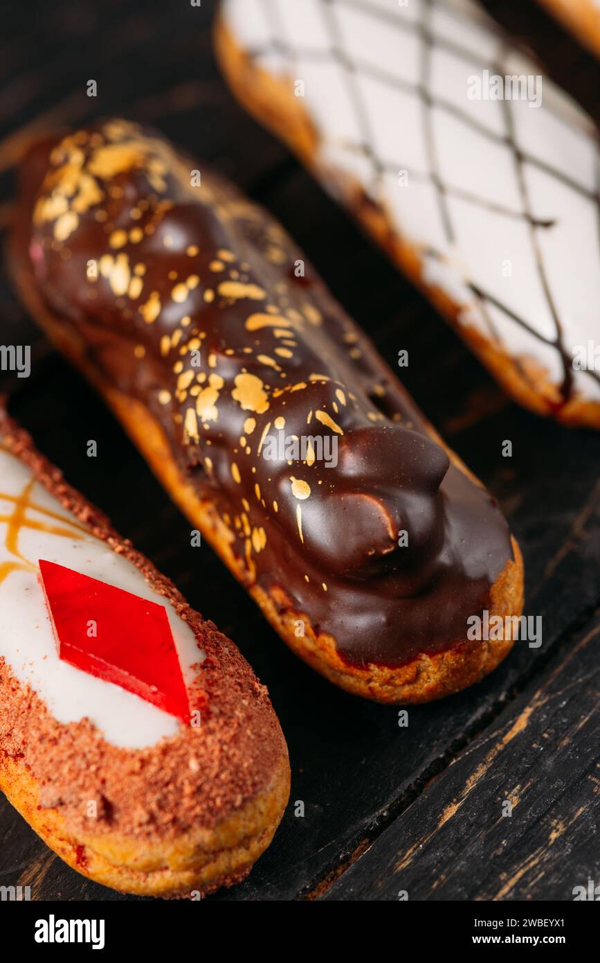 Beautiful delicious french eclairs set with original cream decor on ...