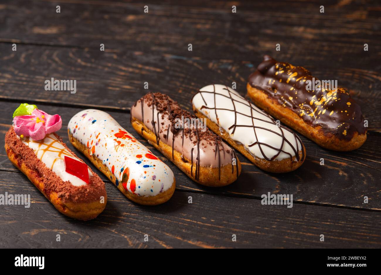 Beautiful delicious french eclairs set with original cream decor on ...