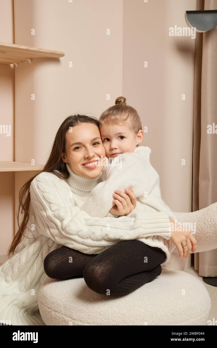 A caring young mother embracing her precious little child Stock Photo ...