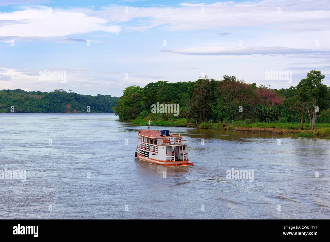 Traditional wooden boat navigating on the Tapajos River, Para state ... Traditional wooden boat navigating on the Tapajos River, Para state ...