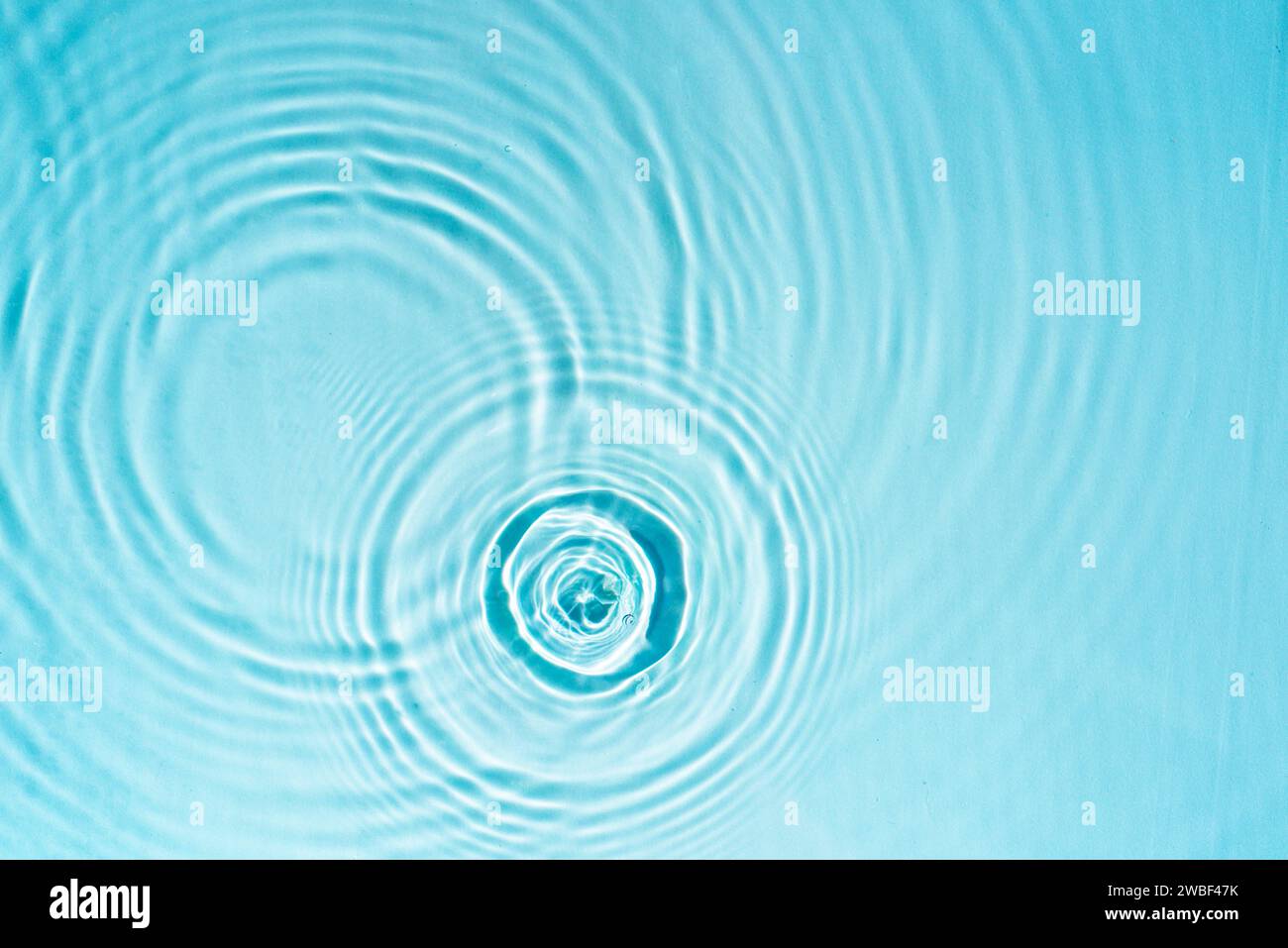 Blue transparent water texture with circles from drops Stock Photo - Alamy