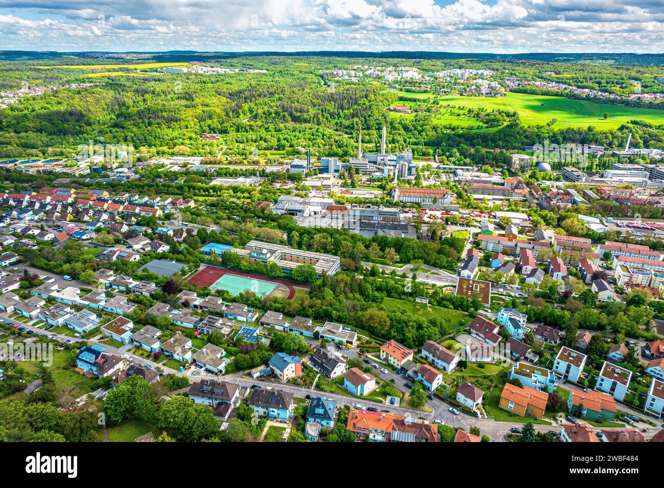 Aerial view of an urban landscape with residential areas, green spaces ...