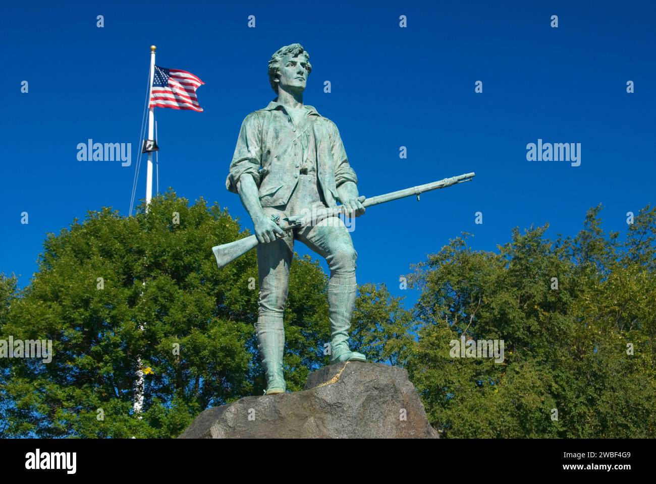 Captain Parker statue on Battle Green with American flag, Lexington ...