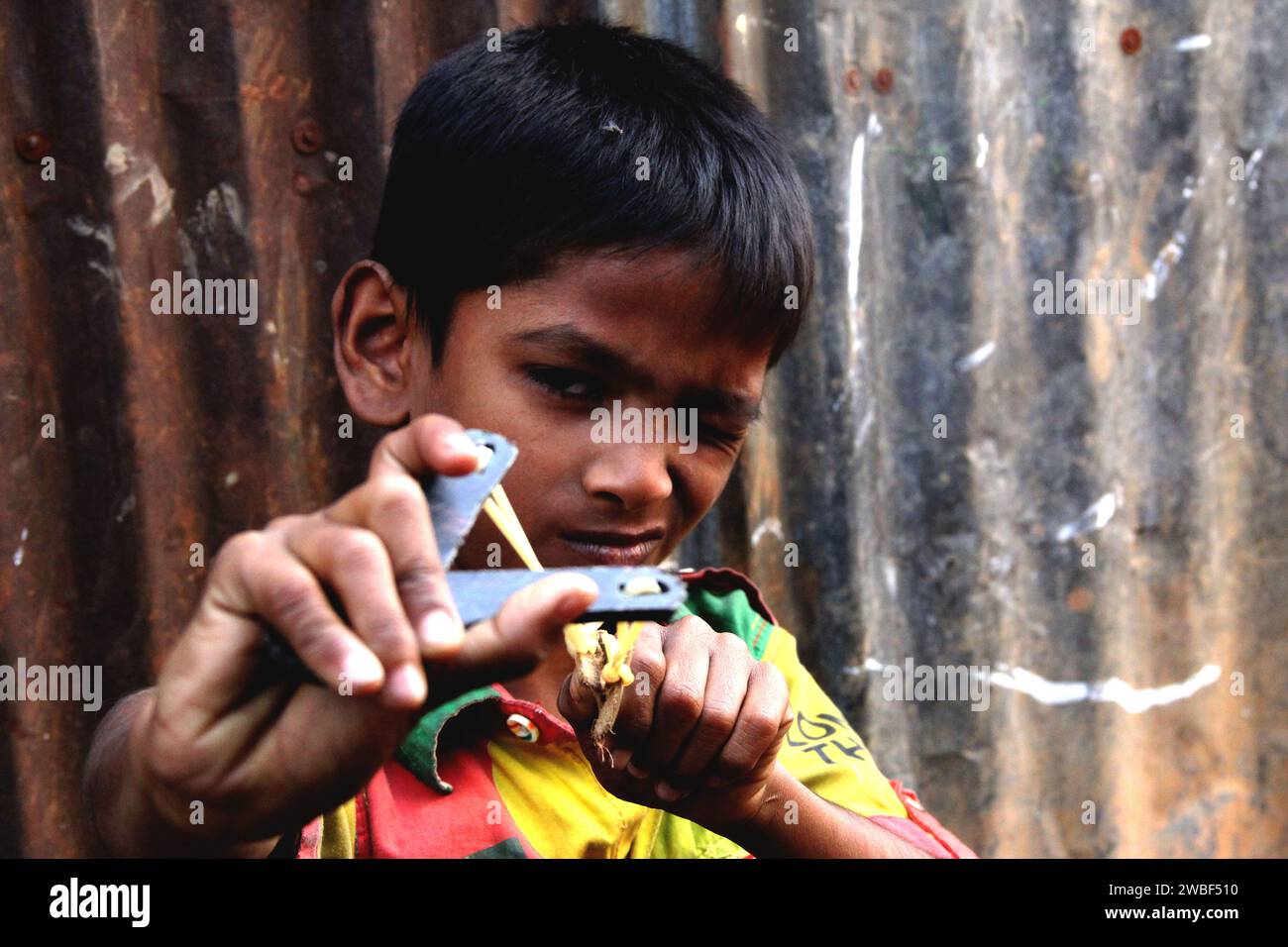 Portrait of a boy in the slums of Rayer bazar. Bangladesh Stock Photo ...