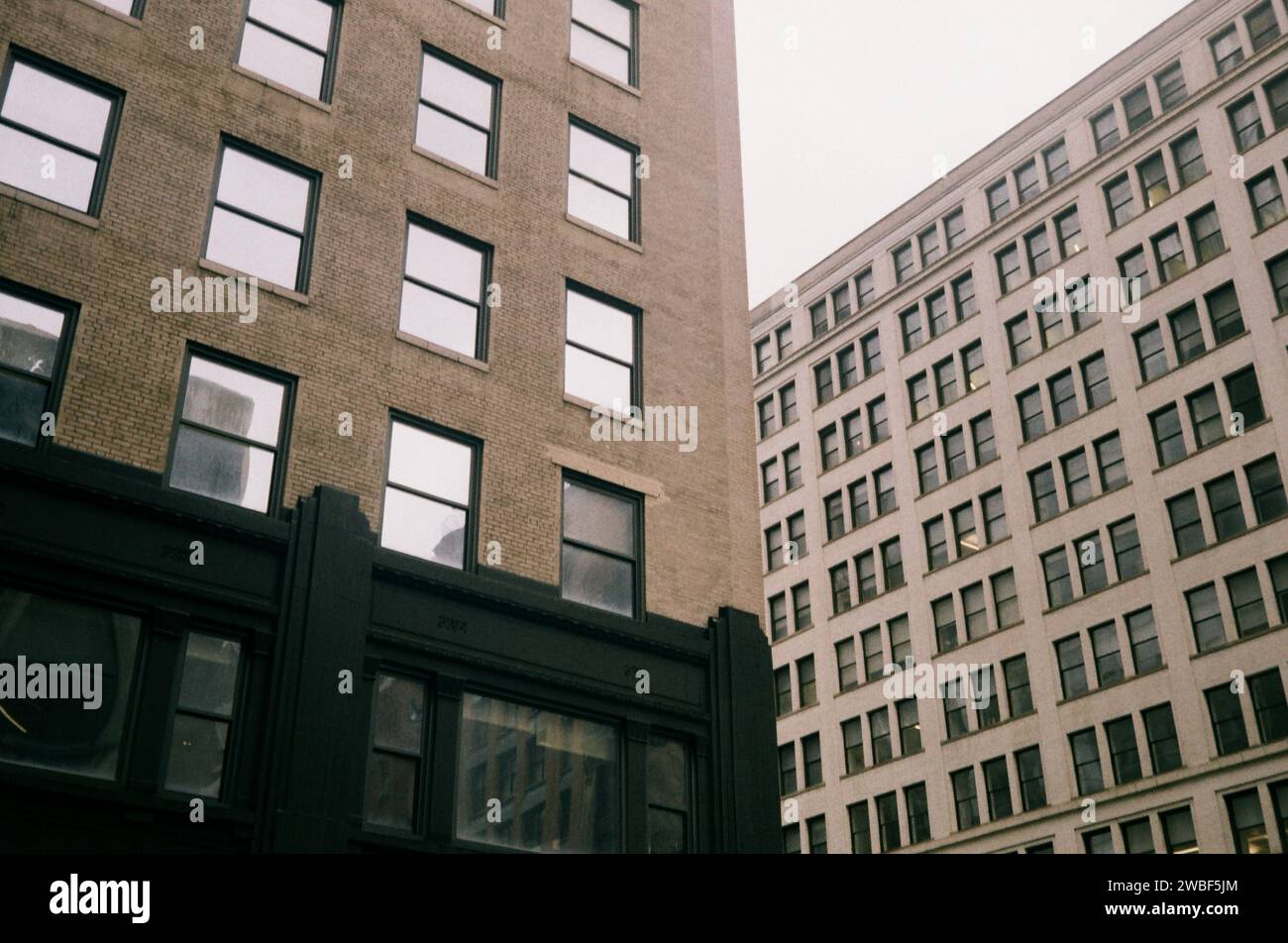 Two high-rise buildings stand in close proximity to each other ...
