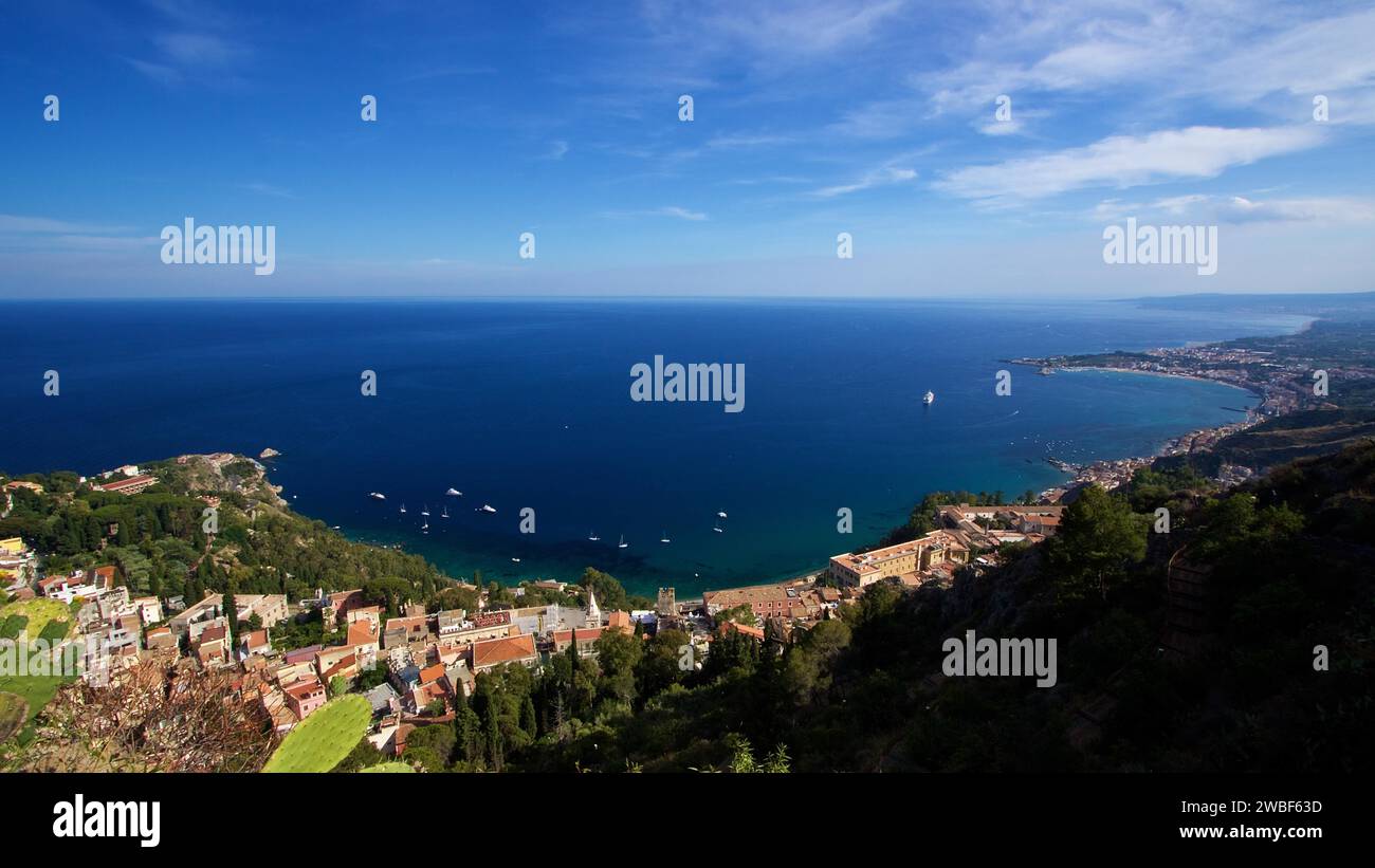 Breathtaking view of a coastal town with clear blue water and sky ...