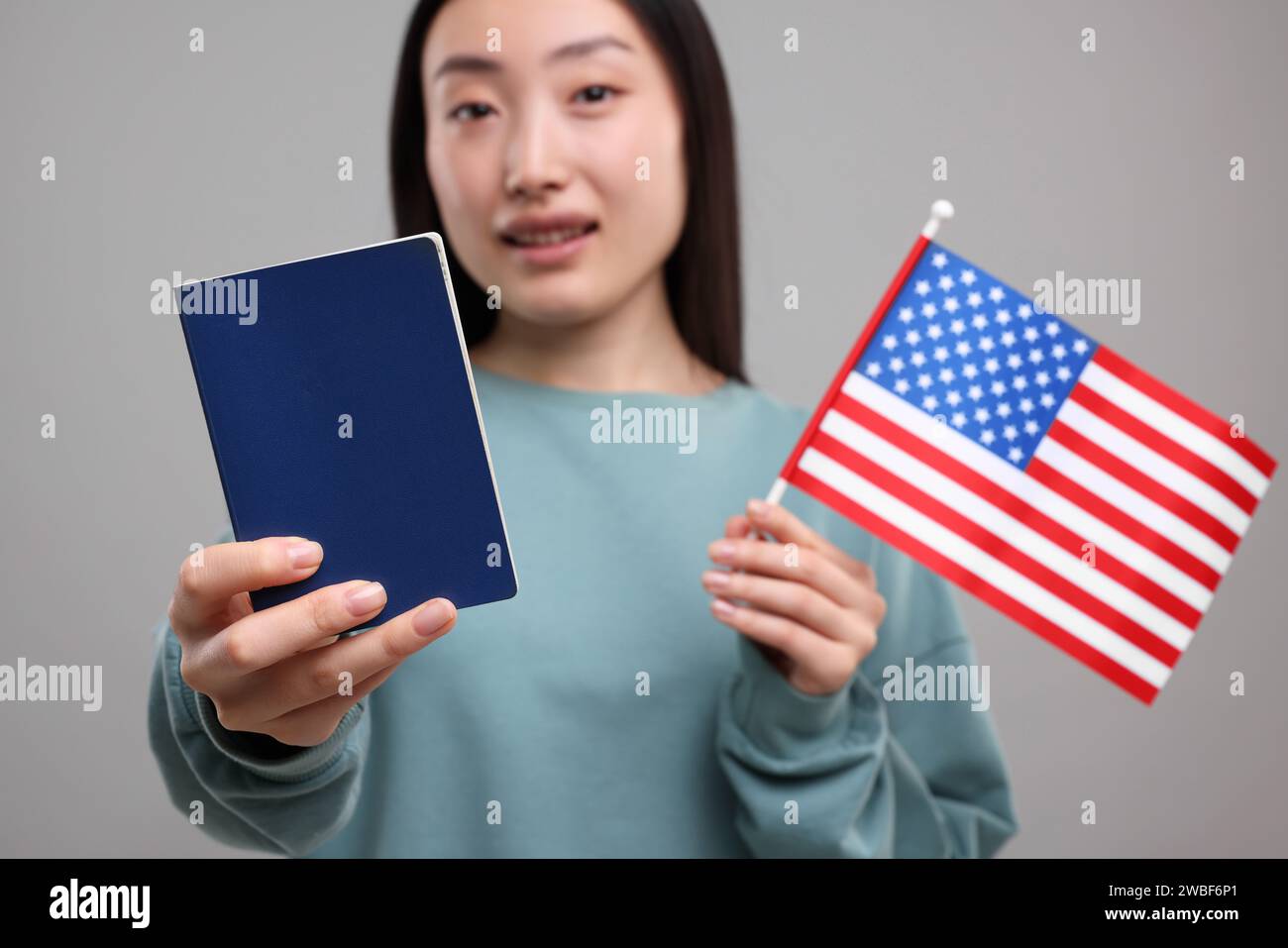 Immigration to United States of America. Woman with passport and flag ...