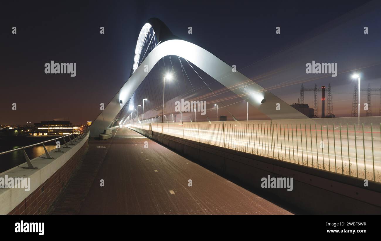 Night view of a modern bridge with futuristic architecture and ...