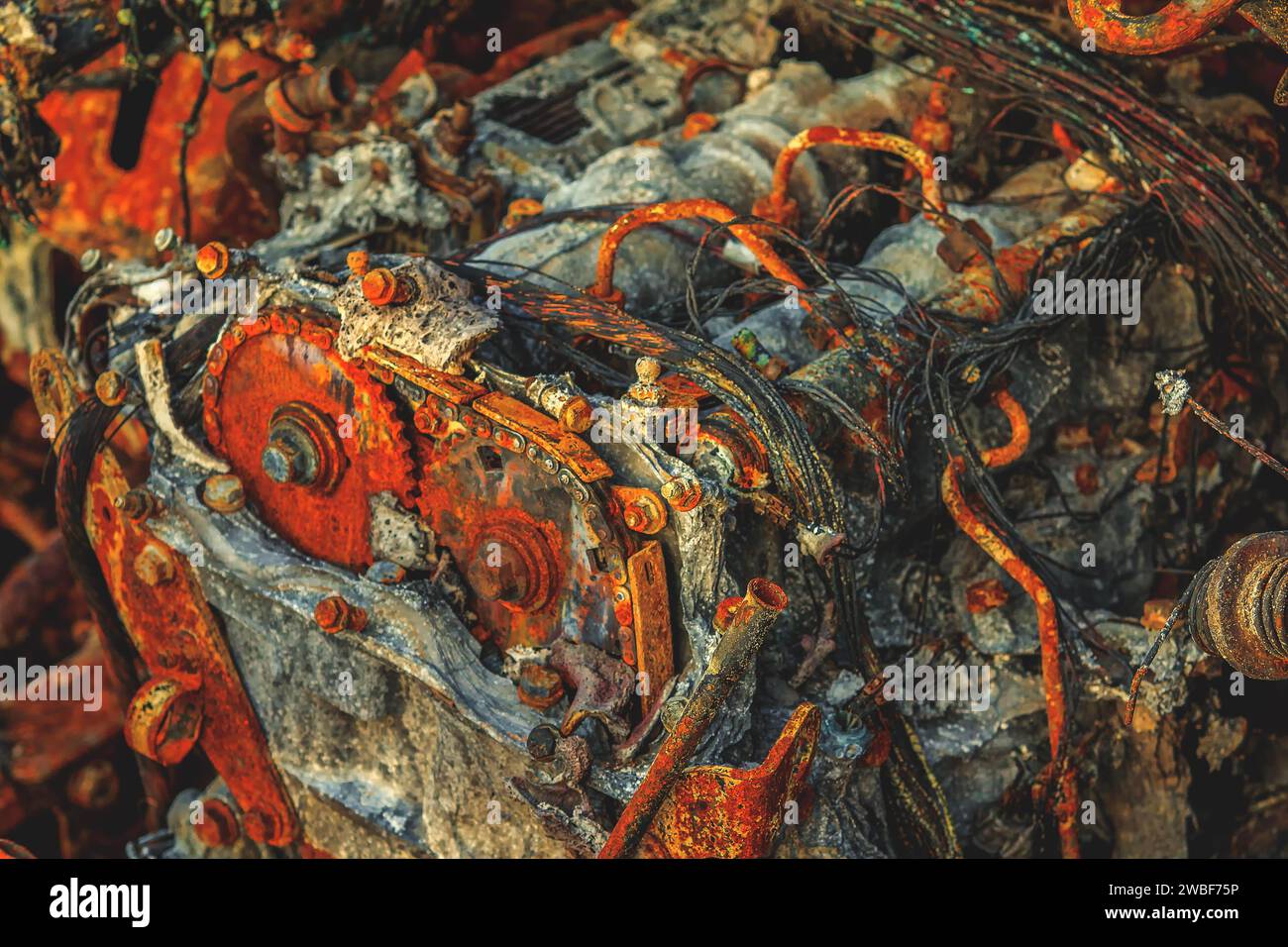 Close-up of a rusted and damaged engine with clearly visible metal ...