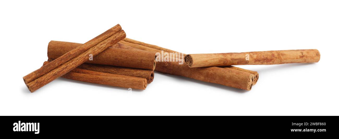 Dry aromatic cinnamon sticks isolated on white Stock Photo - Alamy