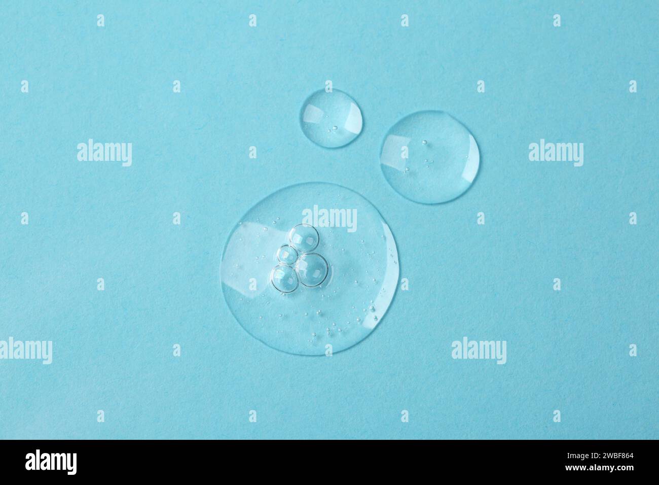 Samples of cosmetic serum on light blue background, flat lay Stock ...