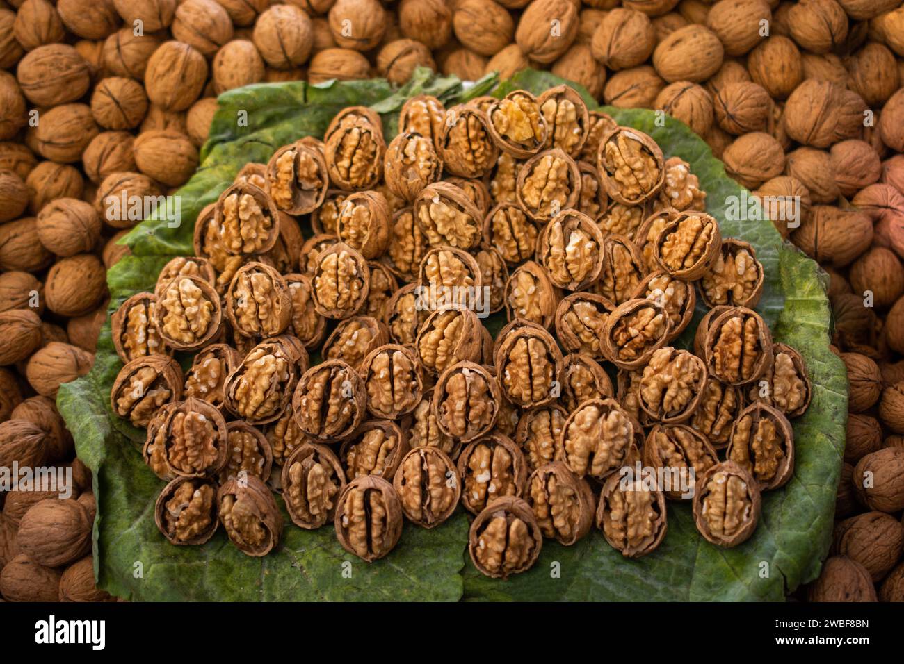 Walnuts in shell heap pattern as organic food background Stock Photo ...