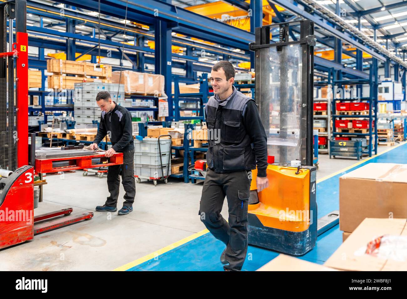 Male handling workers in a modern logistic factory on duty Stock Photo ...
