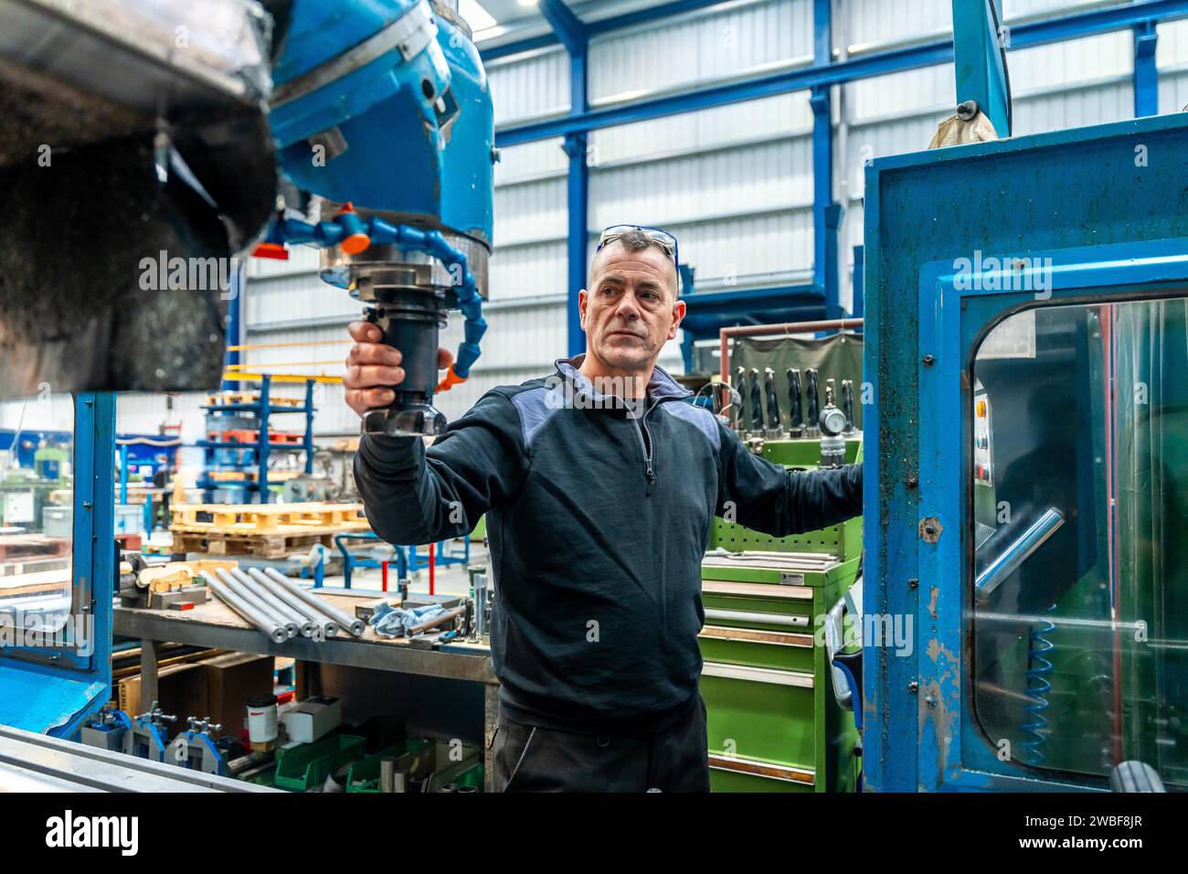 Expert of Male Software engineer working in front of automated CNC ...