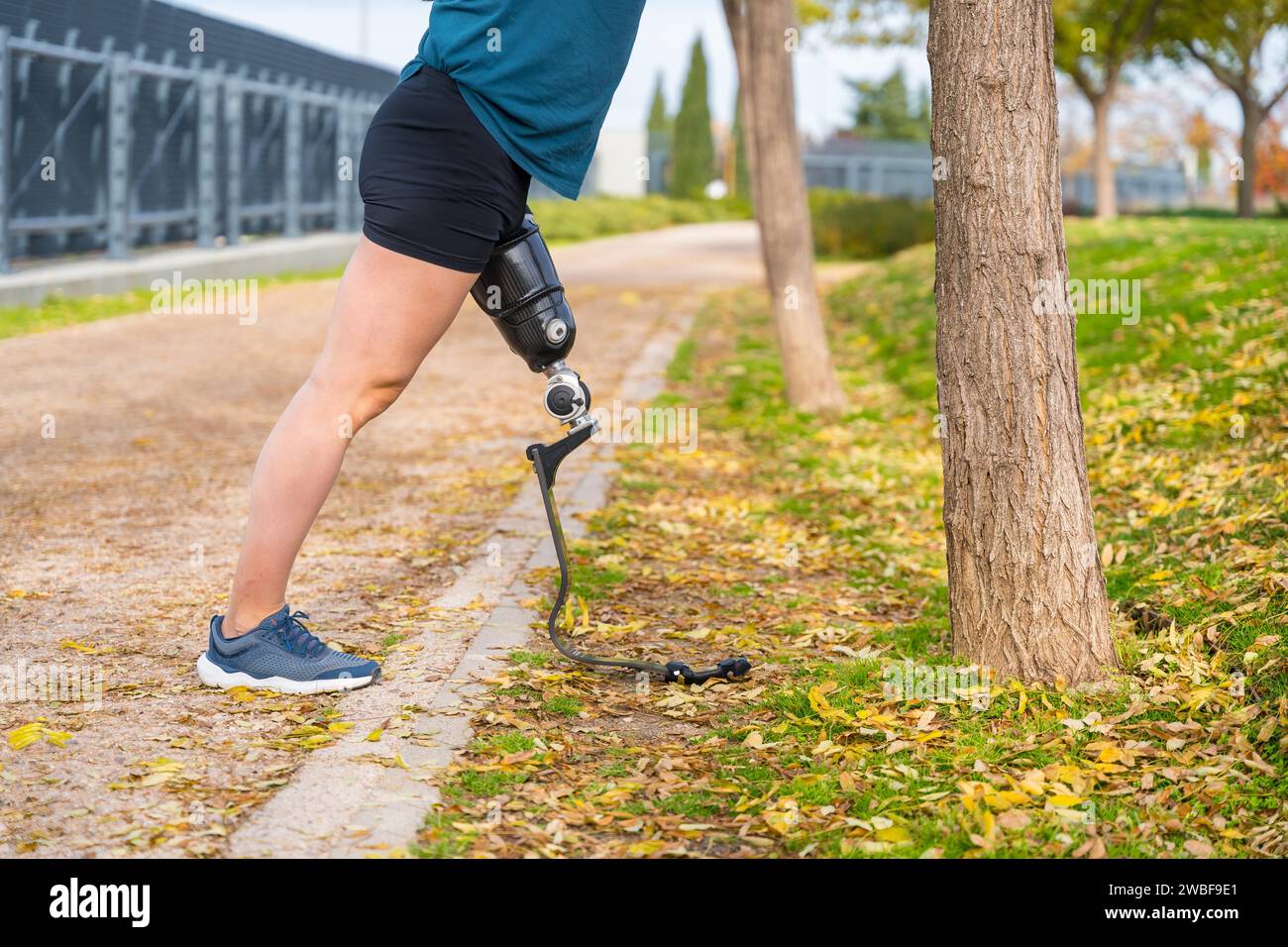 Unrecognizable man with amputee leg using prosthesis stretching after ...