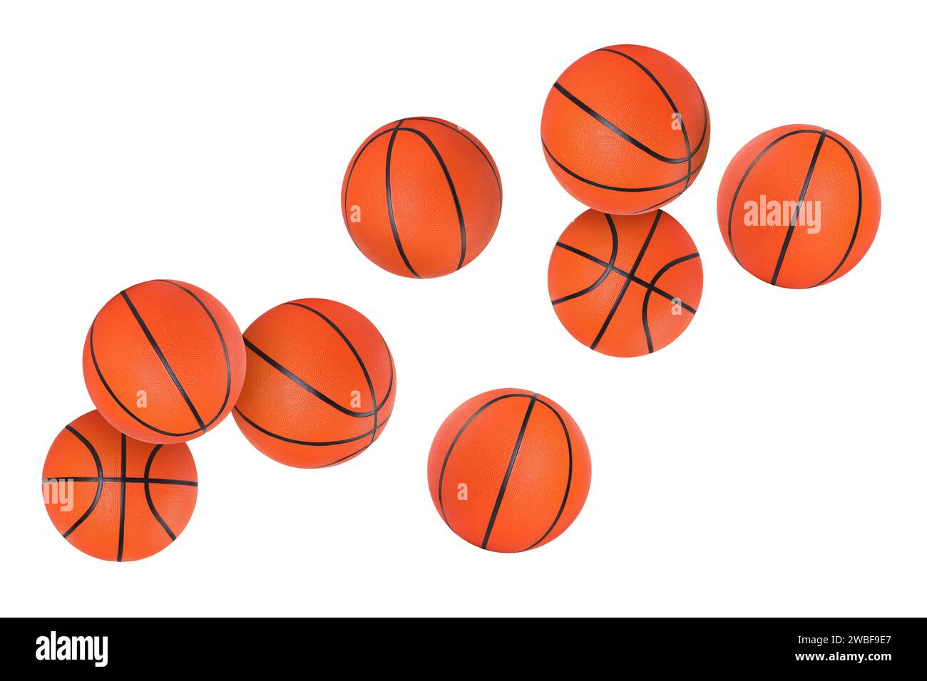 Many basketball balls flying on white background Stock Photo - Alamy