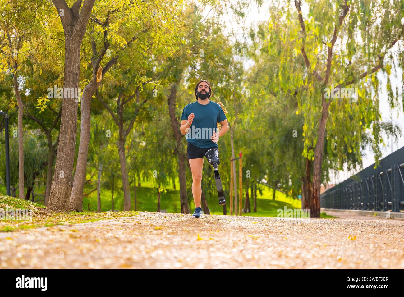 Low angle view photo with copy space of a disabled athletic man running ...