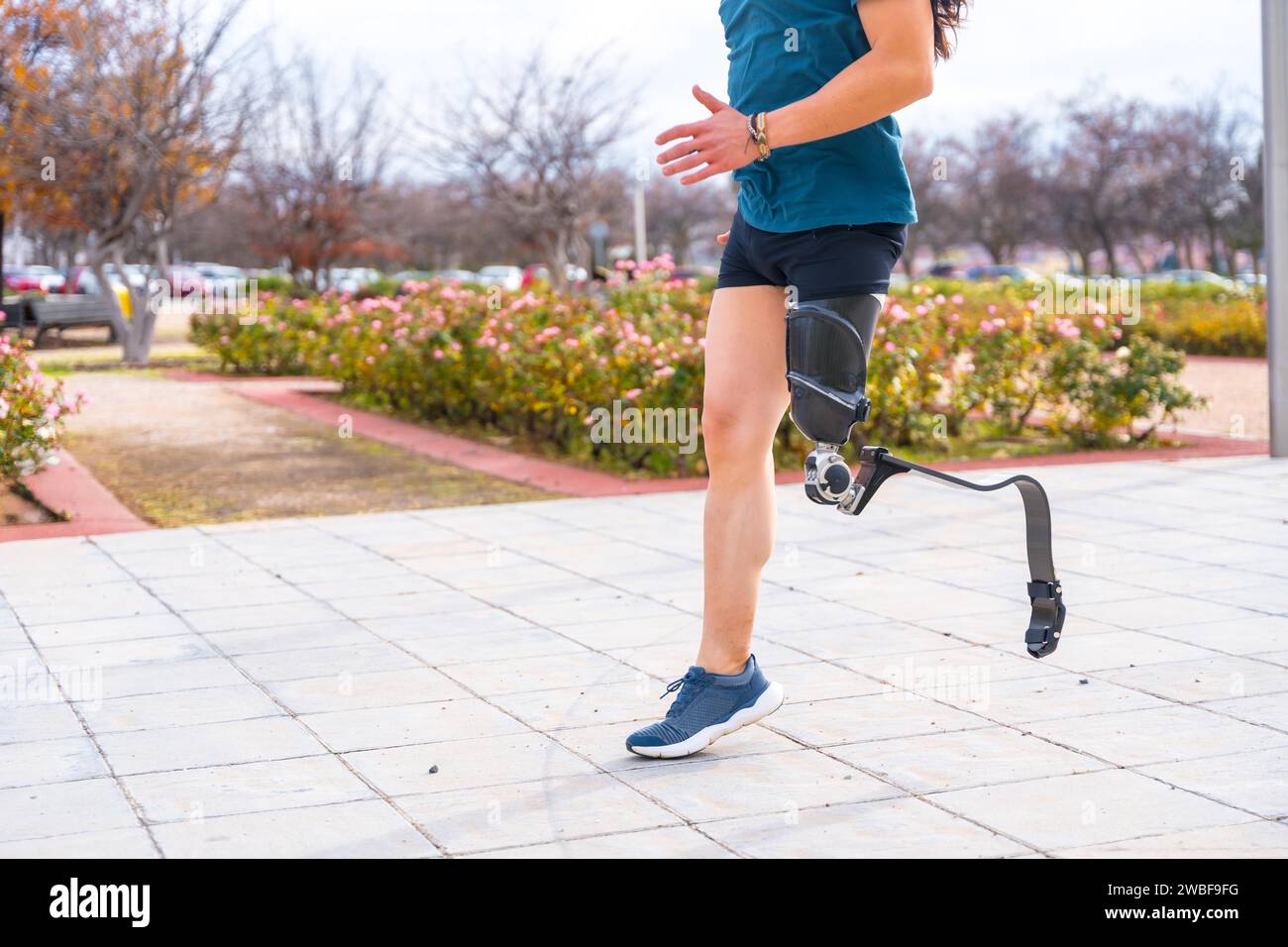 Side view of the lower part of a disabled person with prosthetic leg ...