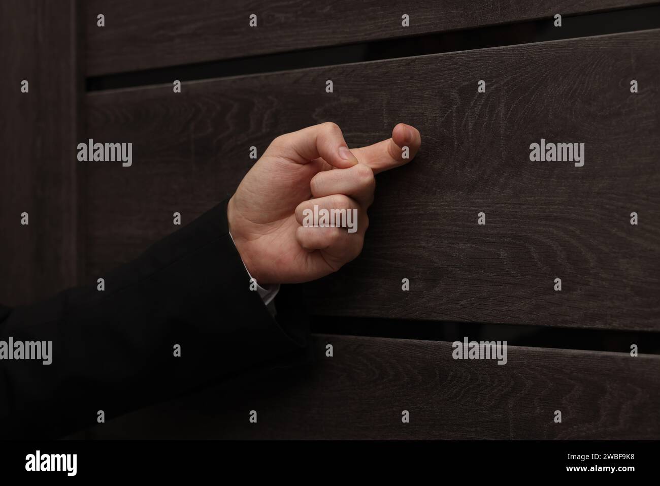 Collector knocking on door indoors, closeup view Stock Photo - Alamy