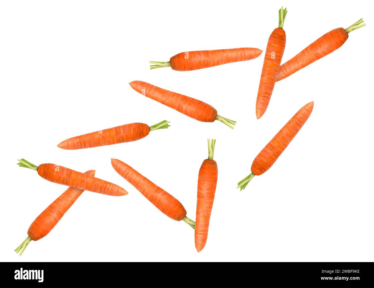 Fresh ripe carrots falling on white background Stock Photo - Alamy