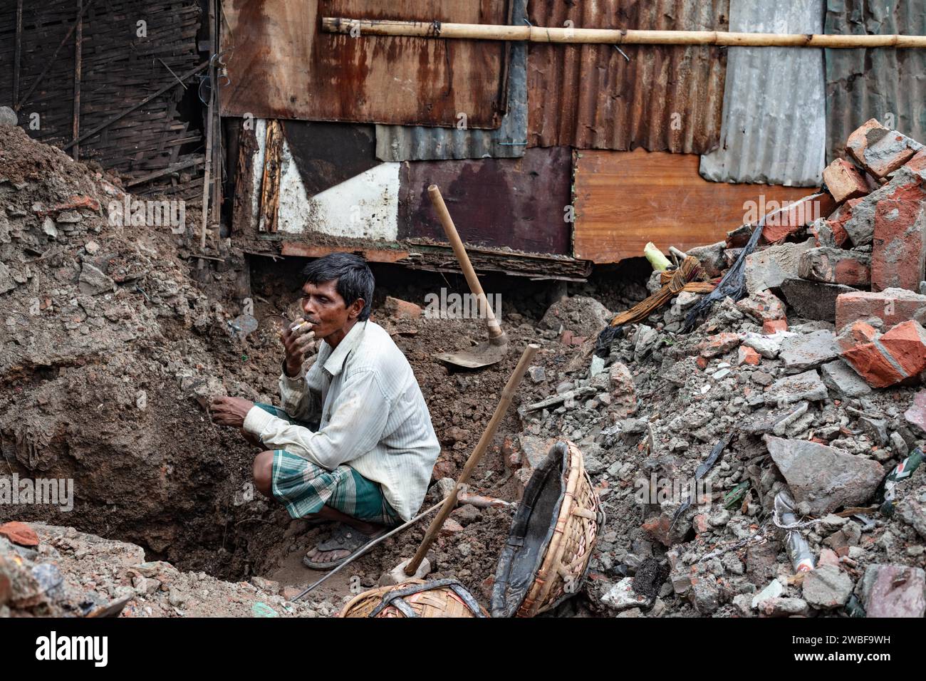 Construction workers resting on a building site, Tejgaon Slum Area ...