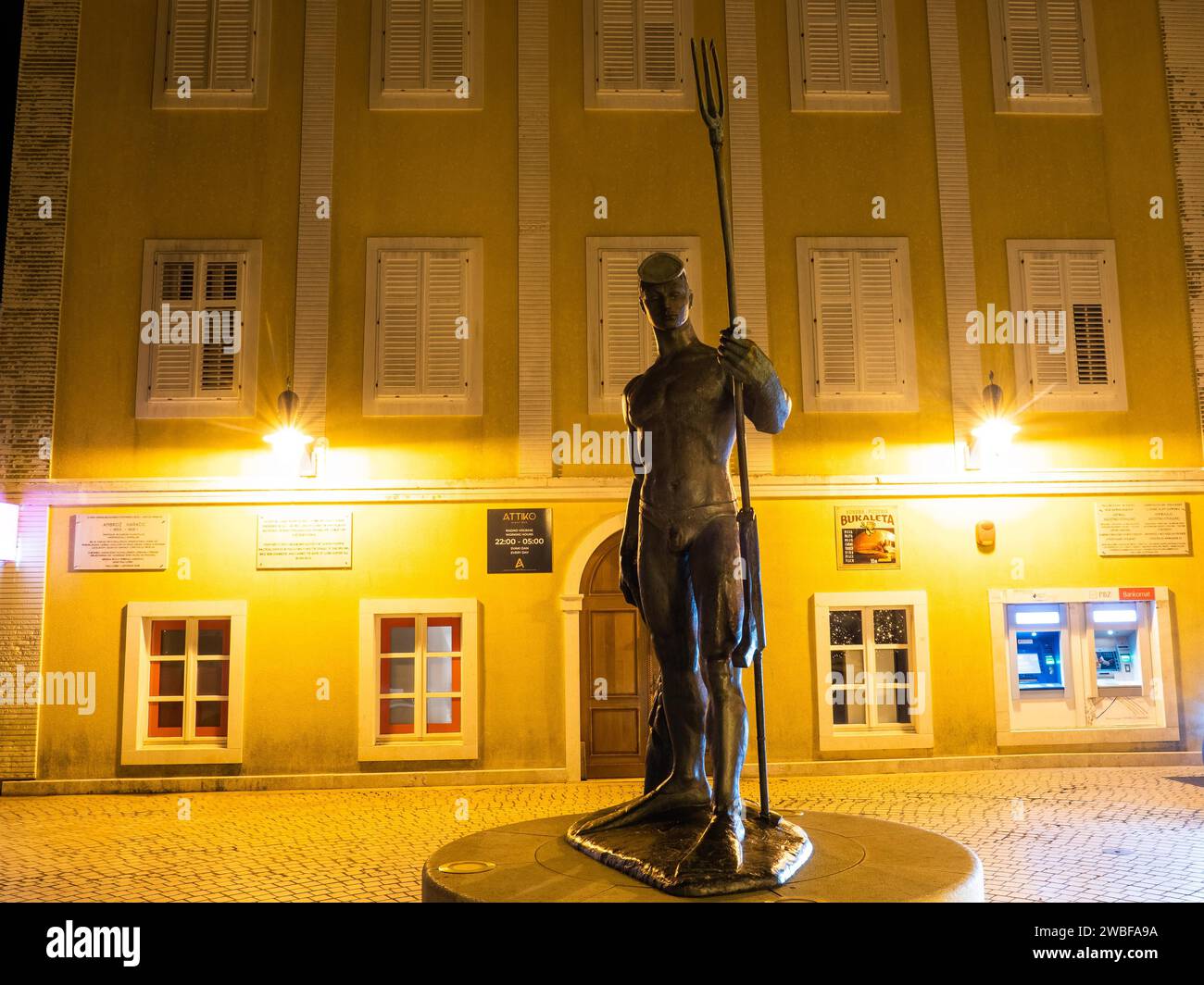 Monument, diver with trident, night shot, harbour of Mali Losinj ...