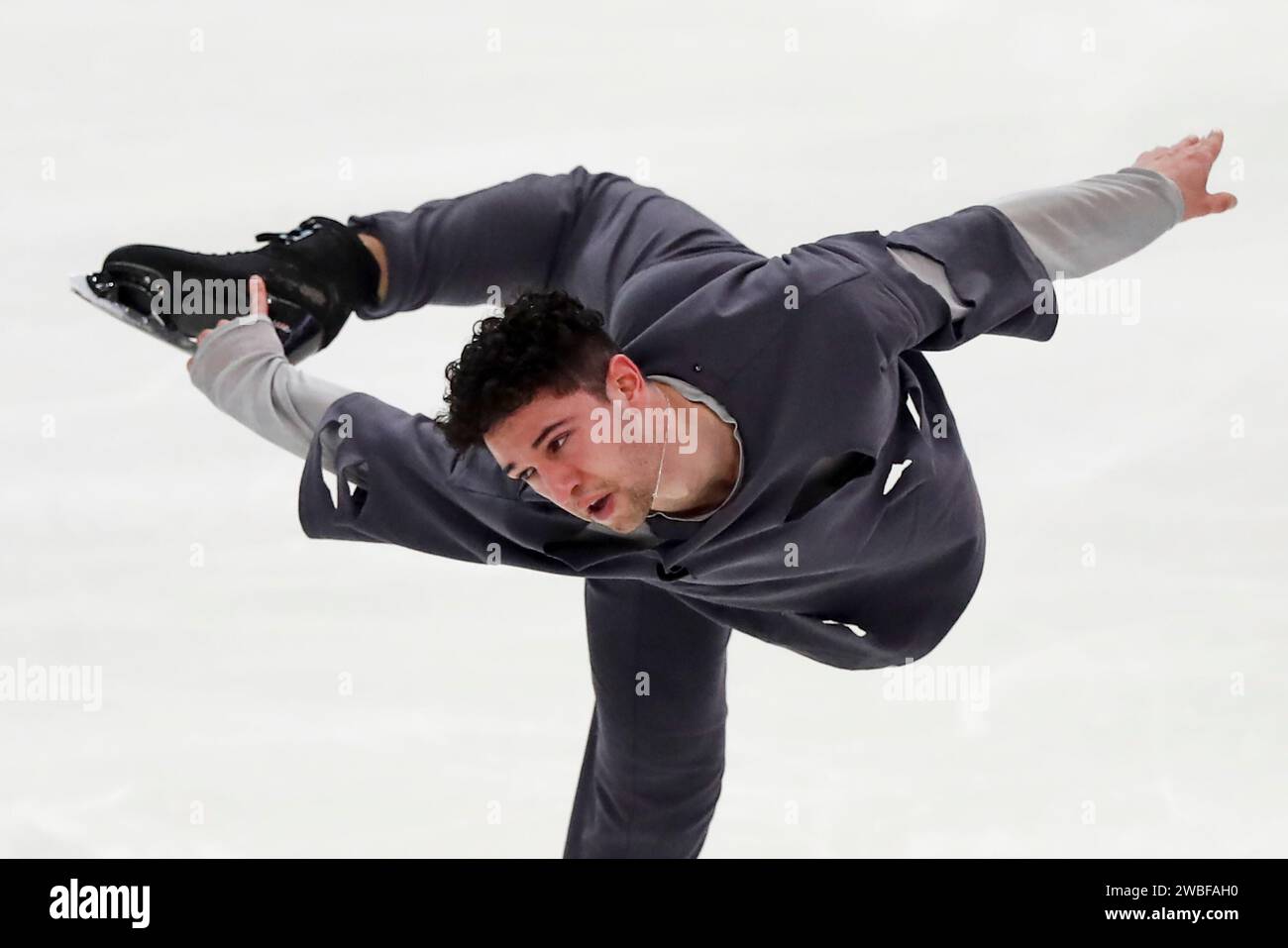 Luc Economides of France performs in the men's short program during the ...
