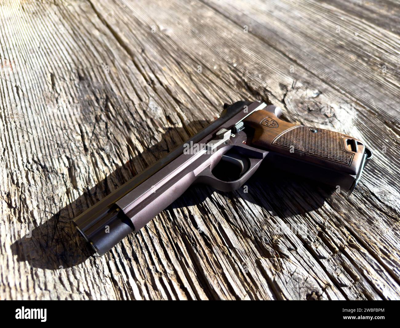 Old Elegant Handgun on an Old Wood Table in a Sunny Day, Made in ...