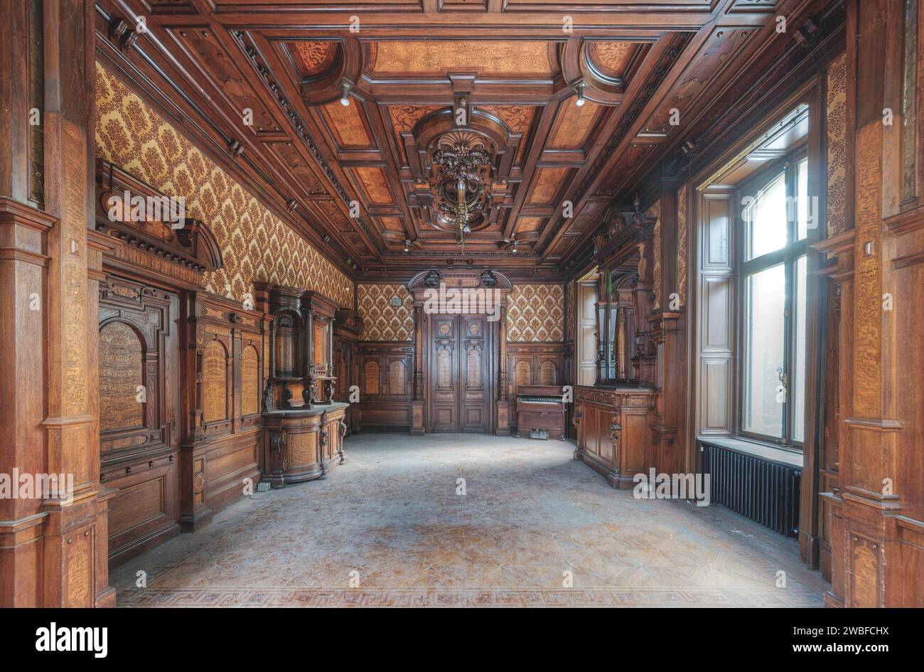 Room with ornate wood carvings on the ceiling and walls, window ...
