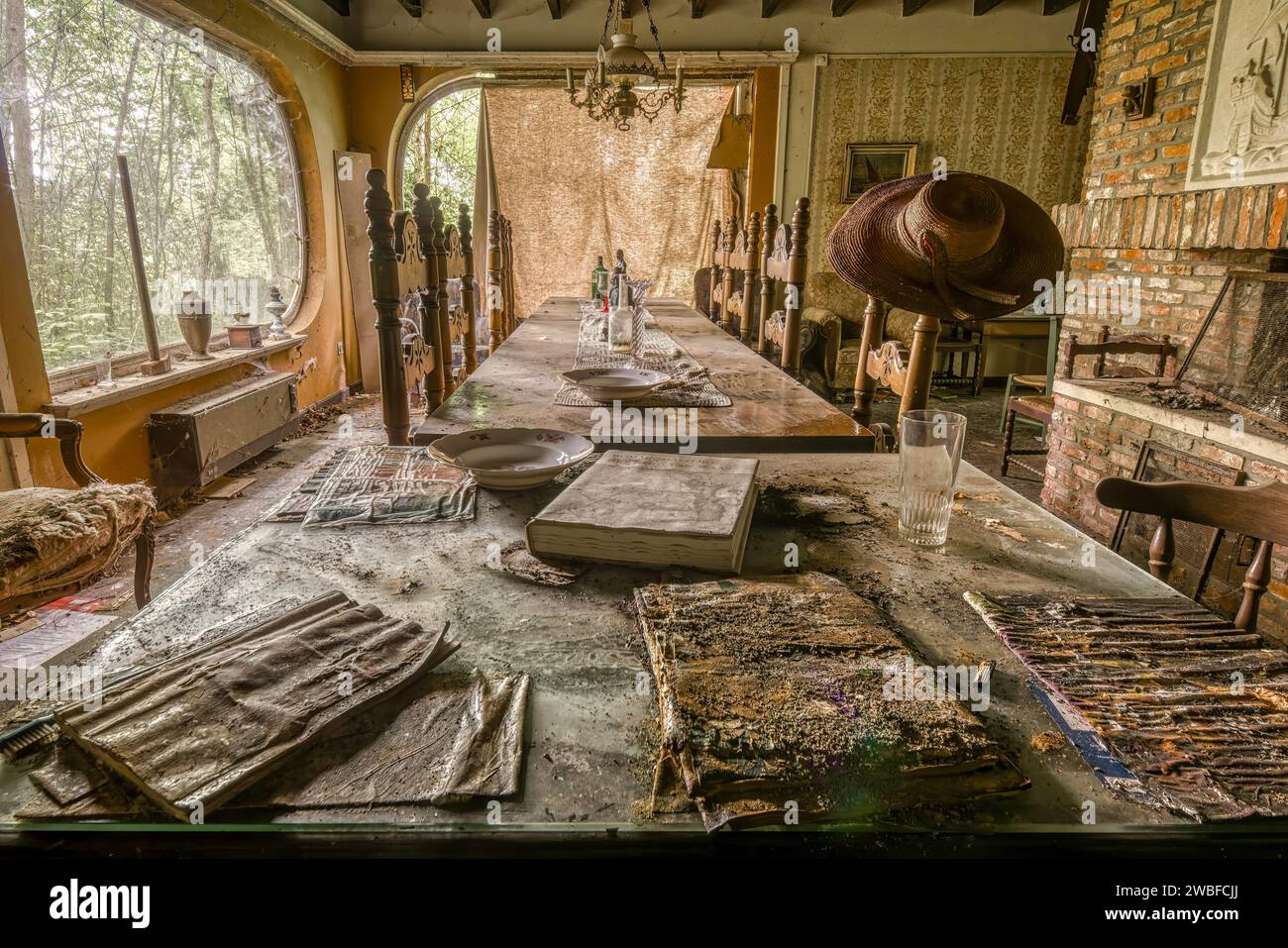 A dilapidated room with rubble on the floor and daylight through the ...