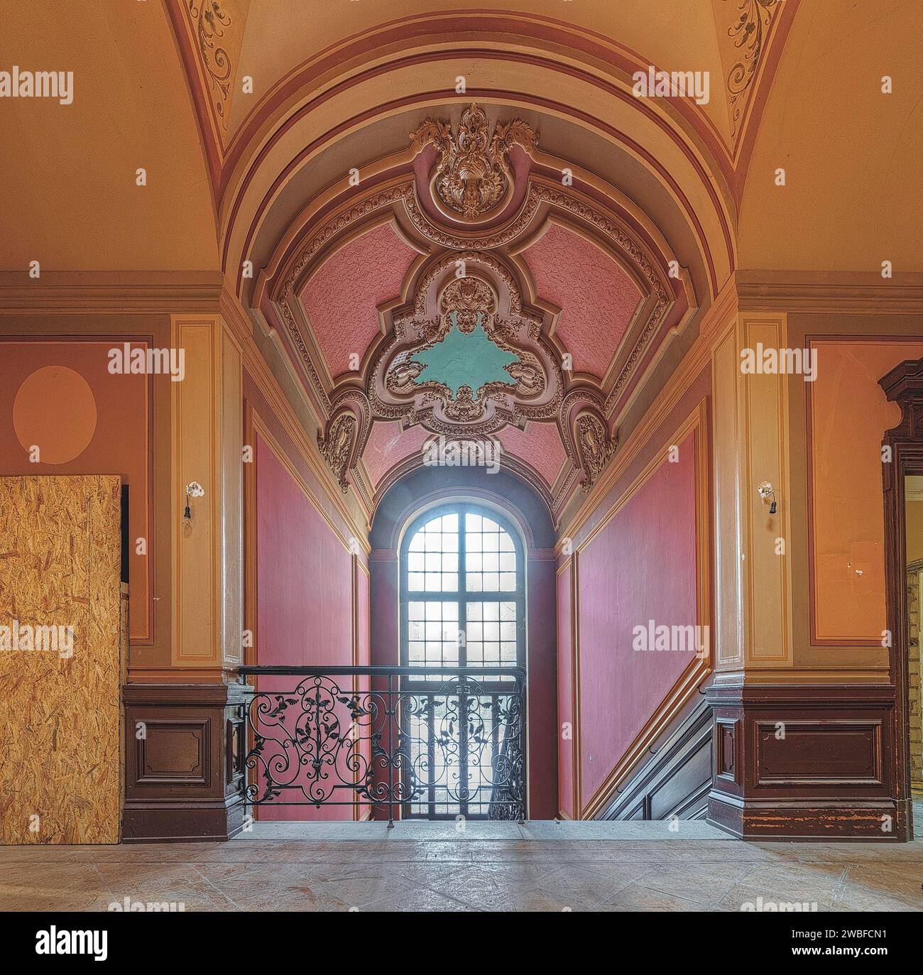 Detail of an elegant corridor with pink walls and elaborate Baroque ...
