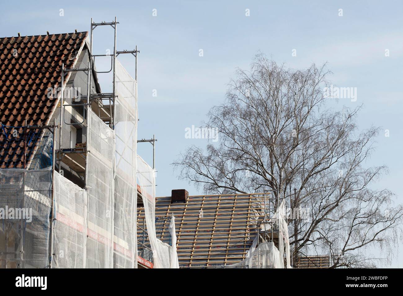 Scaffolded residential building, construction site, refurbishment ...