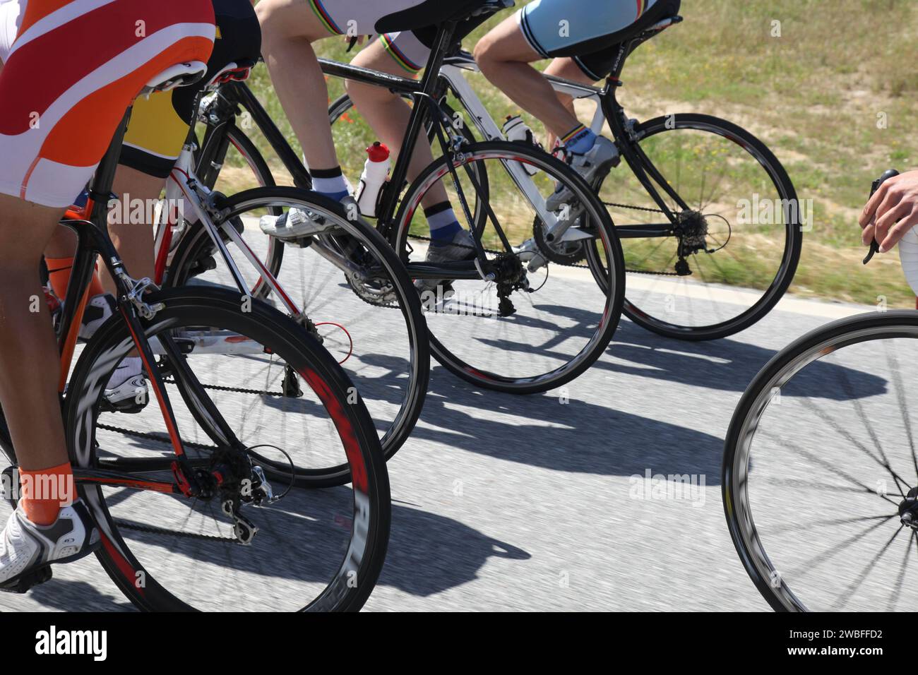 Intense road bike race: cyclists speeding through scenic route ...